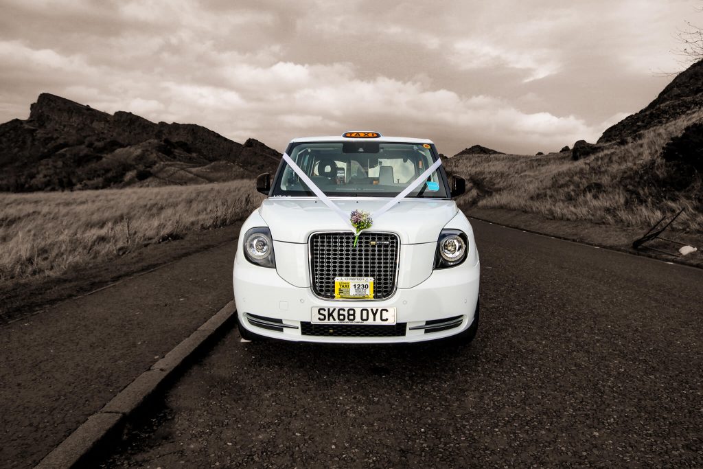 Wedding Taxis - black, white, signed cabs all decorated for you